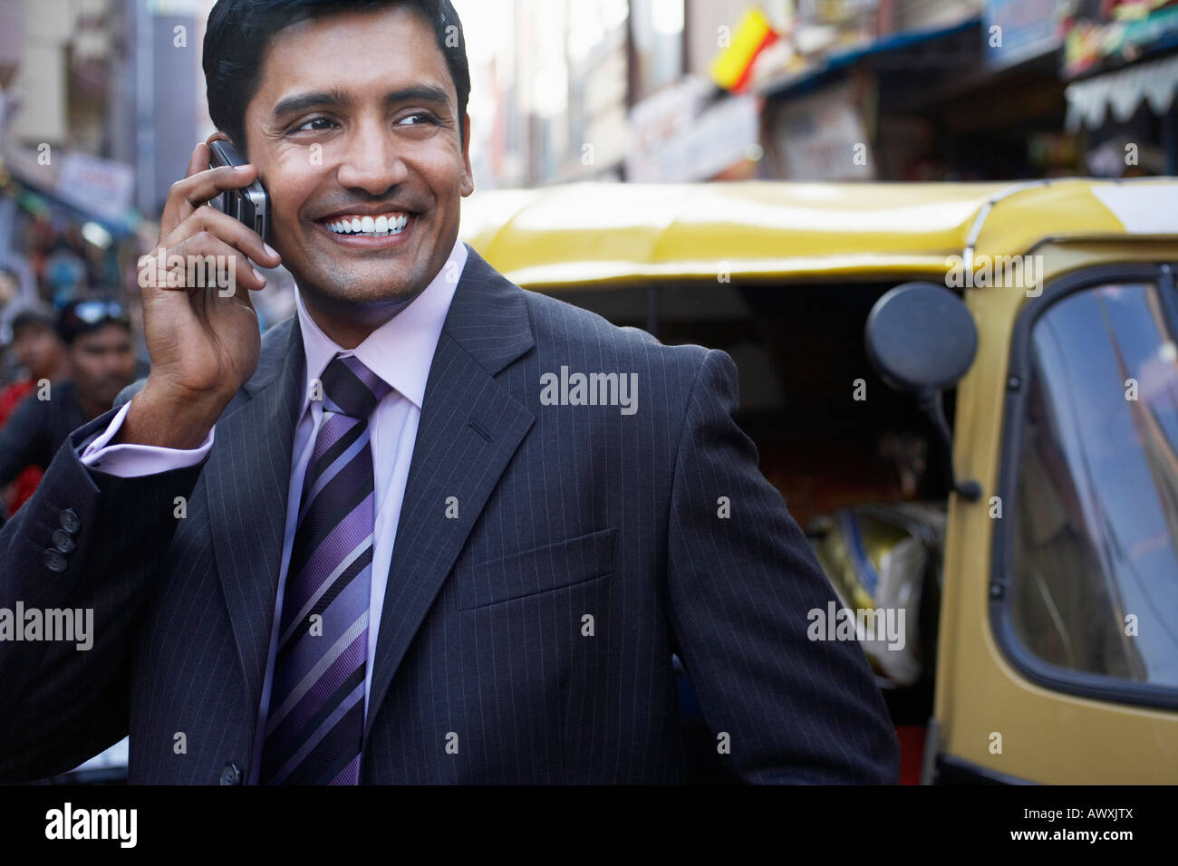 Business man using cell phone, smiling Stock Photo - Alamy
