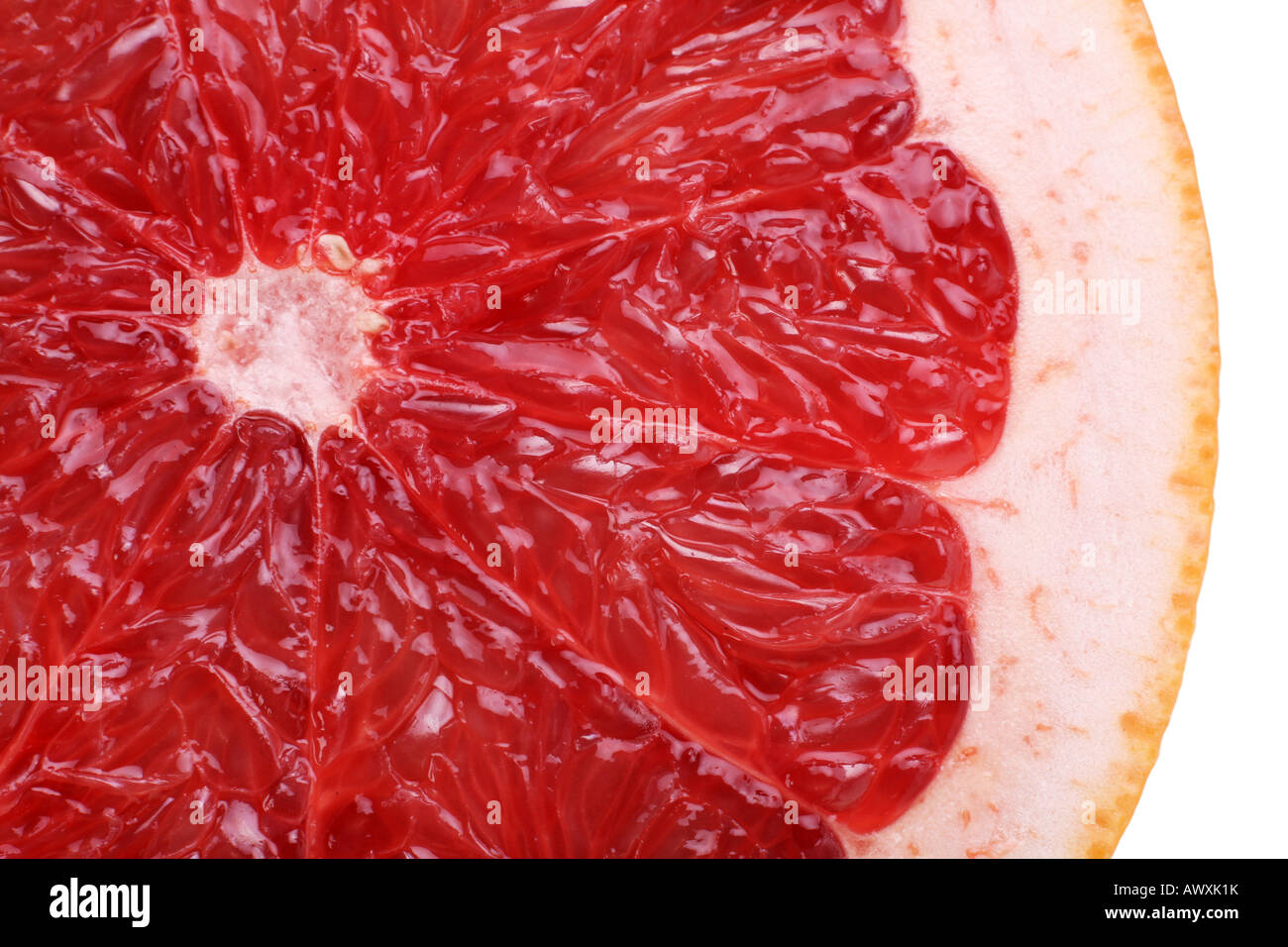 Grapefruit slice detail isolated on white background Stock Photo - Alamy