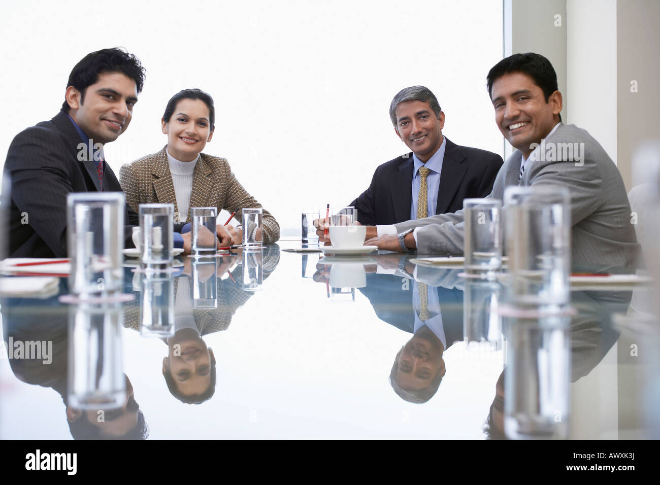 Portrait of business associates during meeting Stock Photo - Alamy