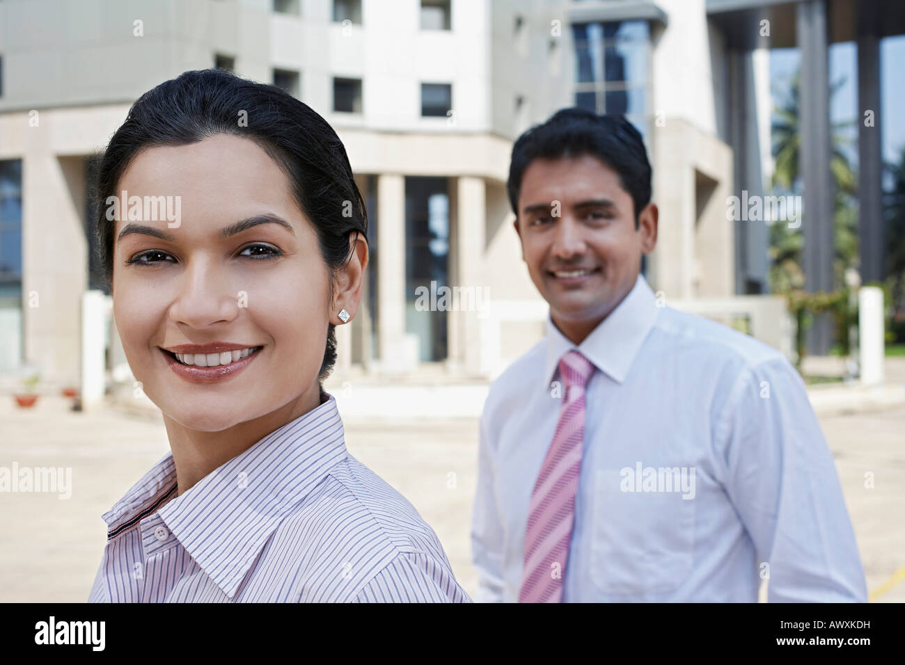 Business man checking watch on city street Stock Photo - Alamy