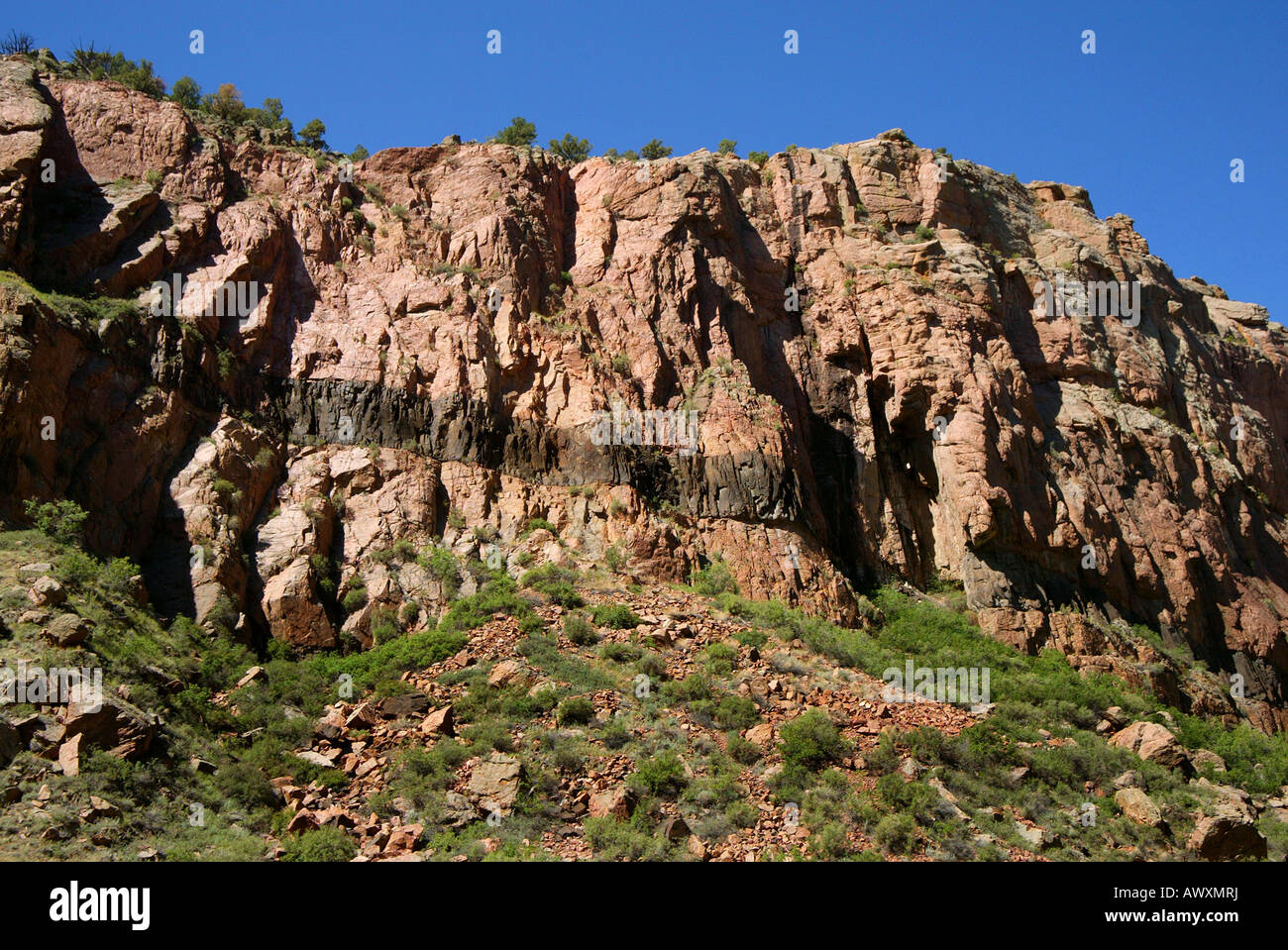 Different colored layers of stone make up the walls of Royal Gorge in ...