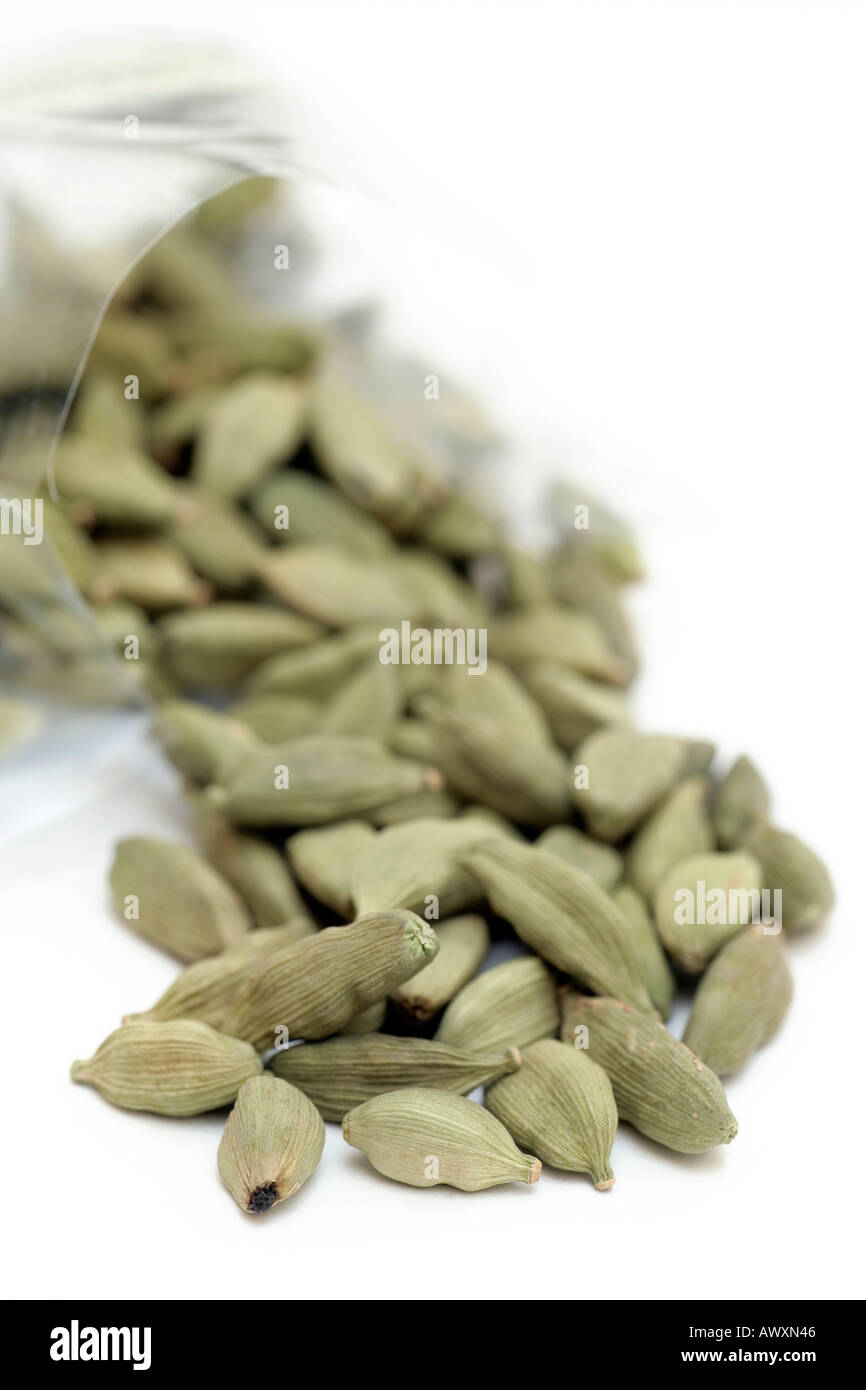 Cardamom Pods Spilling out of Packaging Stock Photo - Alamy