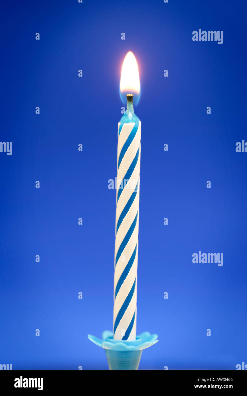Single Birthday Candle on Blue Background Stock Photo - Alamy