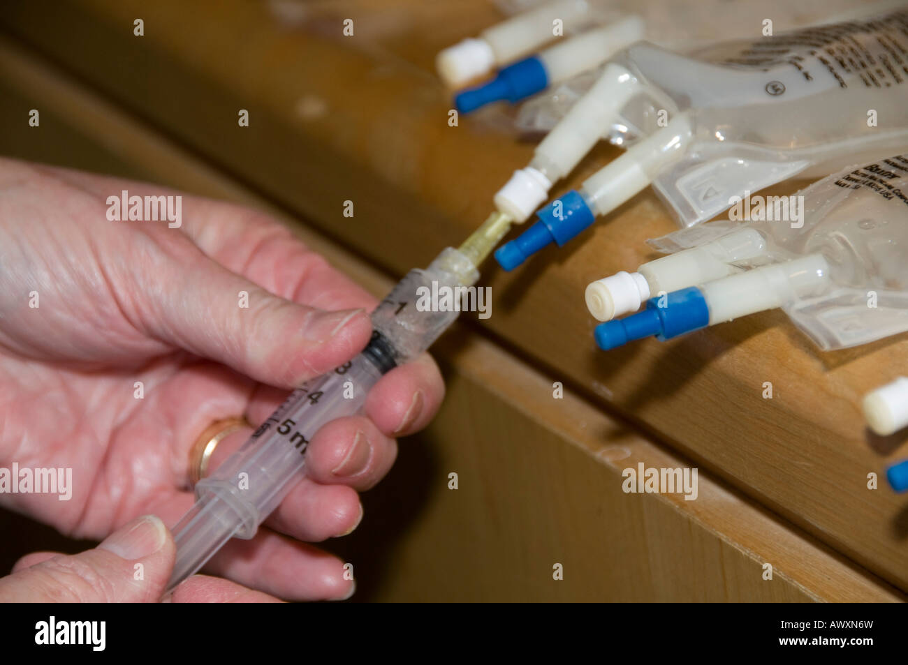 Nurse Preparing IV Medication For Patient Stock Photo - Alamy