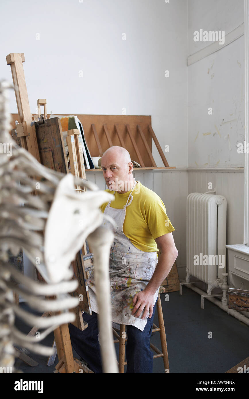 Male artist painting in studio Stock Photo - Alamy