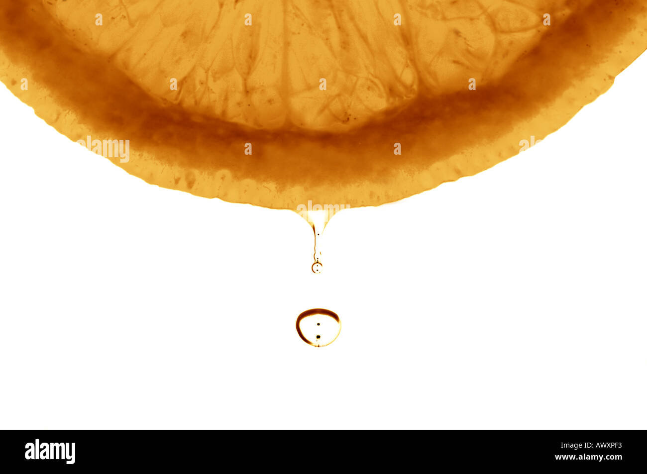 Perfectly sharp and well defined drip of fresh juice from an orange ...