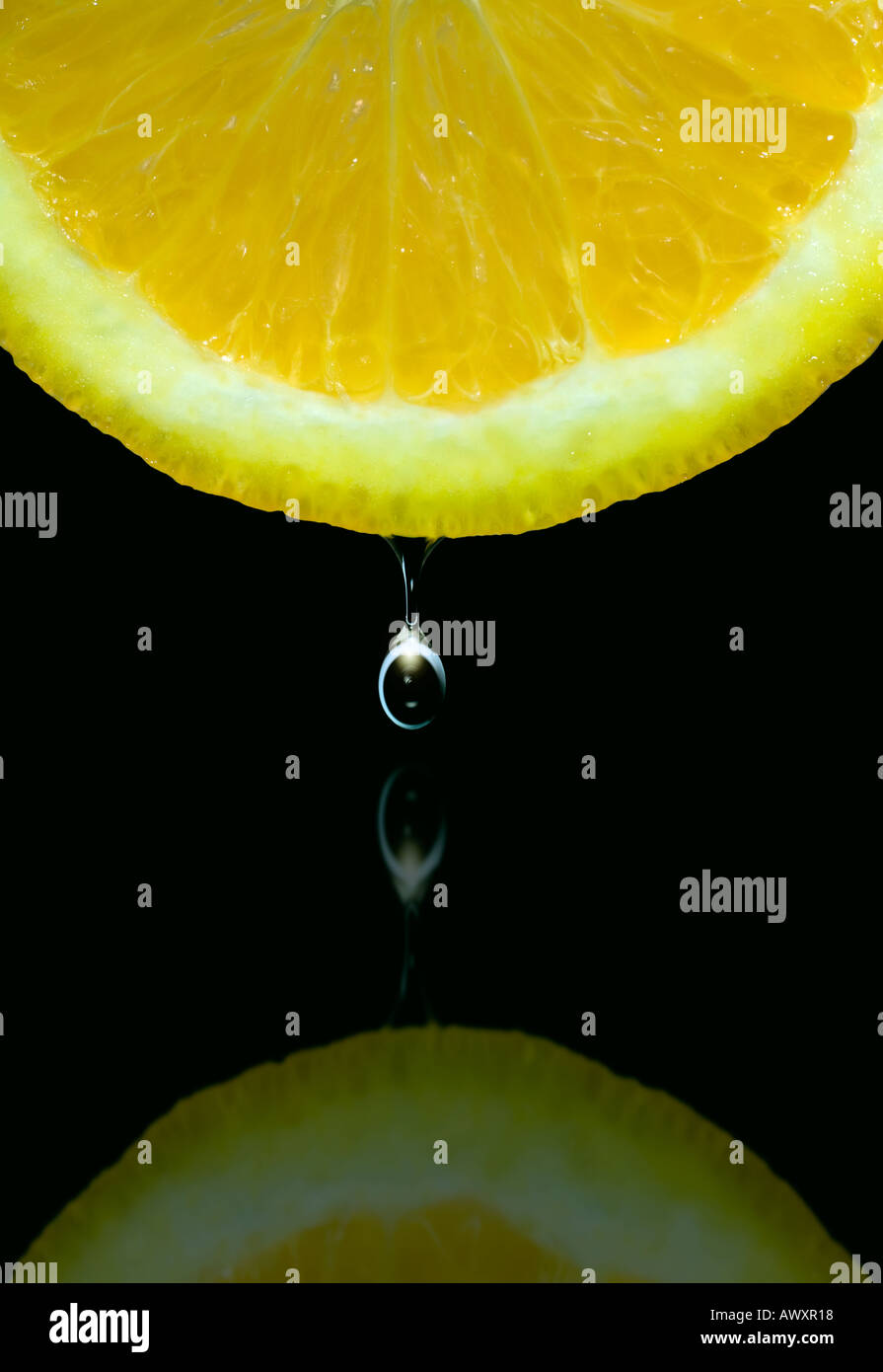 Perfectly sharp and well defined drip of fresh juice from an orange ...
