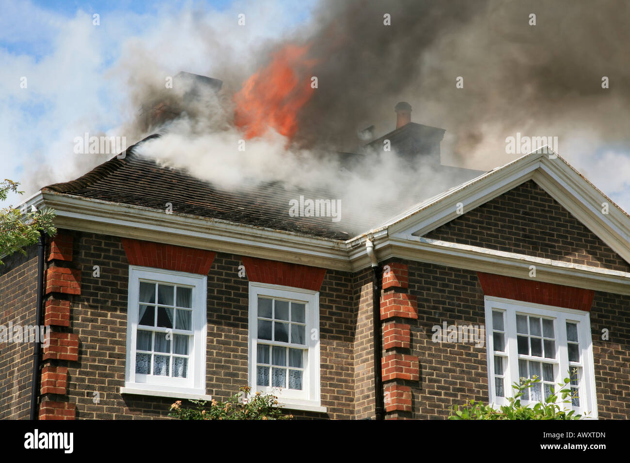 House roof on fire Stock Photo - Alamy