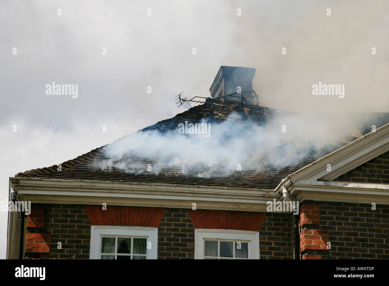House roof on fire Stock Photo - Alamy