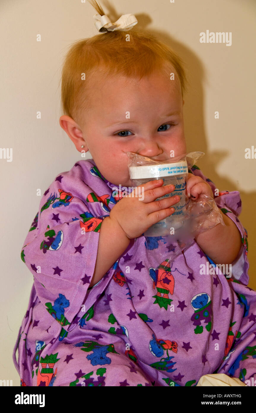 Baby Patient Chewing On Specimen Cup Stock Photo - Alamy