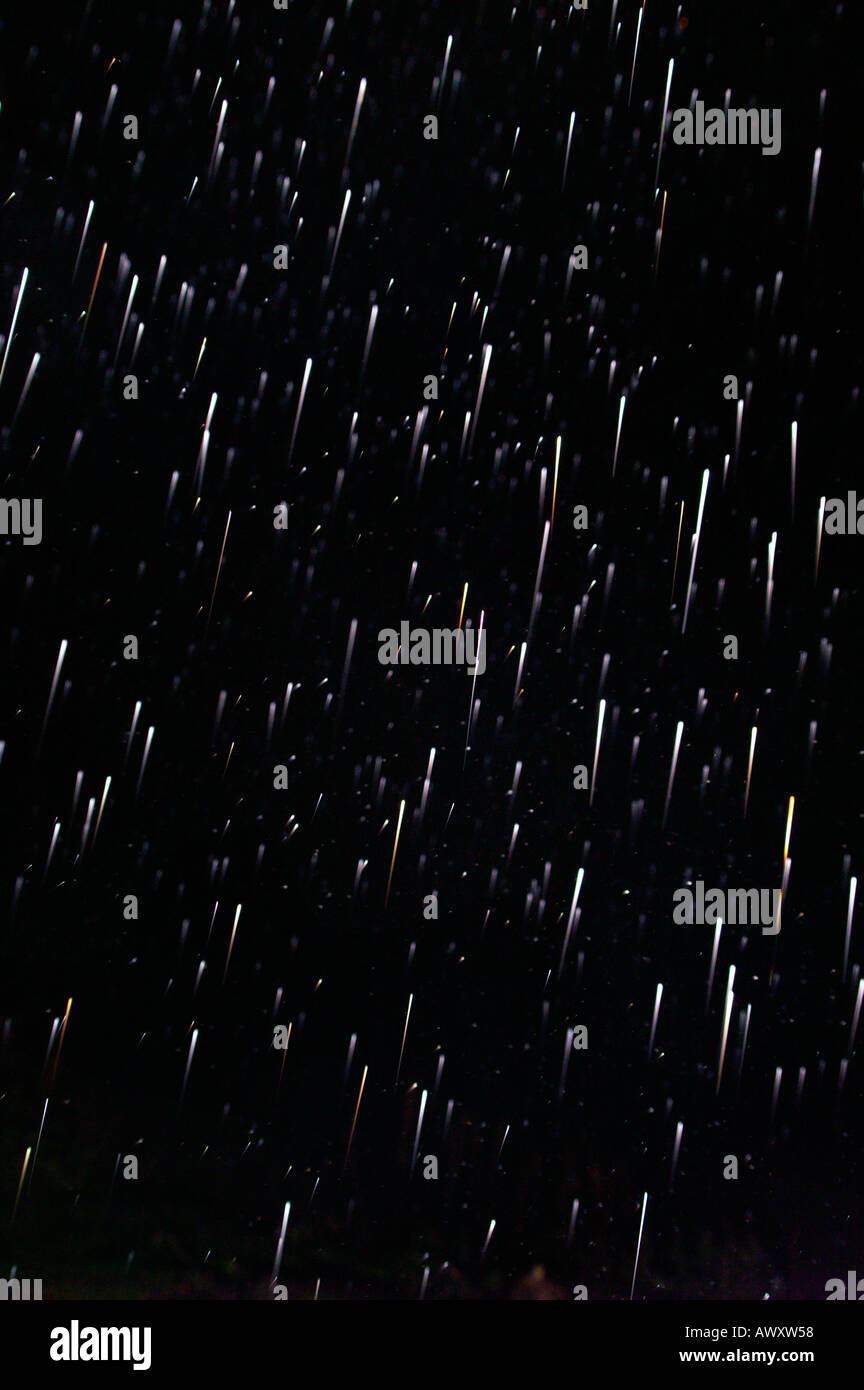 Glowing light Flying comets on black velvet background Stock Photo - Alamy