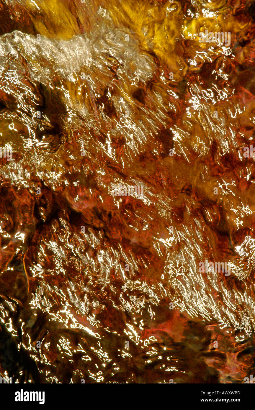 Red orange coloured Light Sun reflection on Water Surface Stock Photo ...