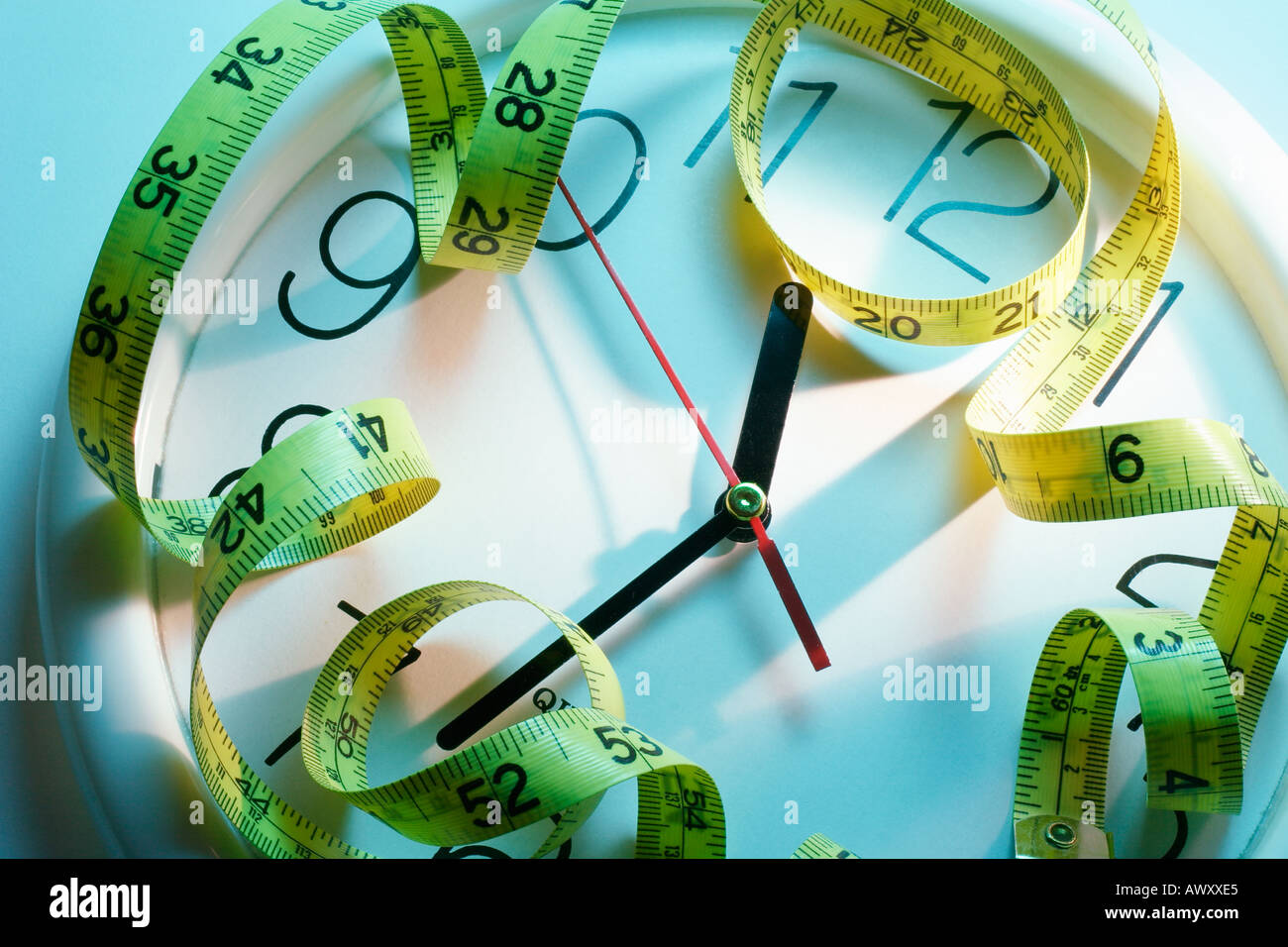 Tape Measure on Clock Stock Photo - Alamy
