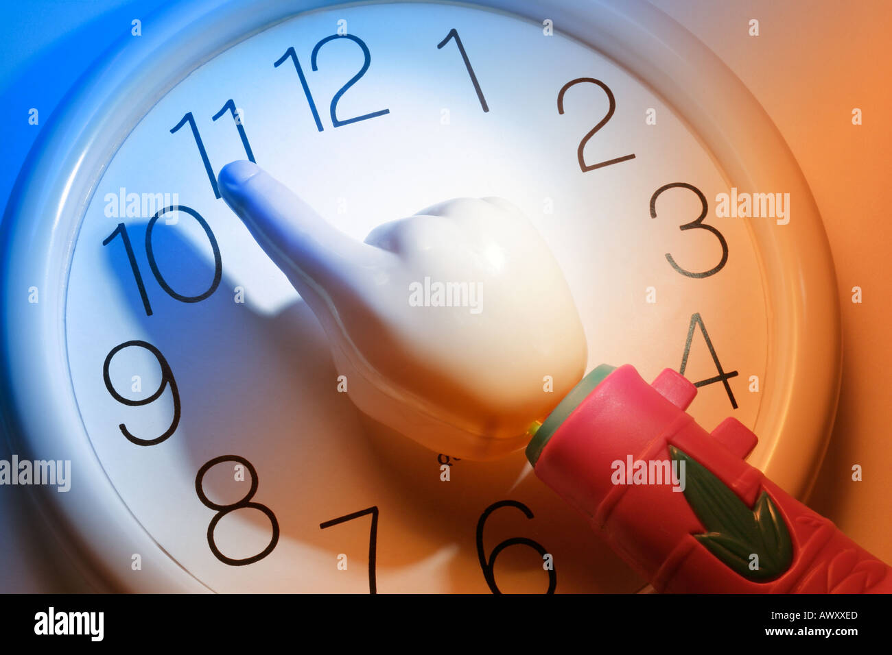 Clock and Toy Hand Stock Photo - Alamy