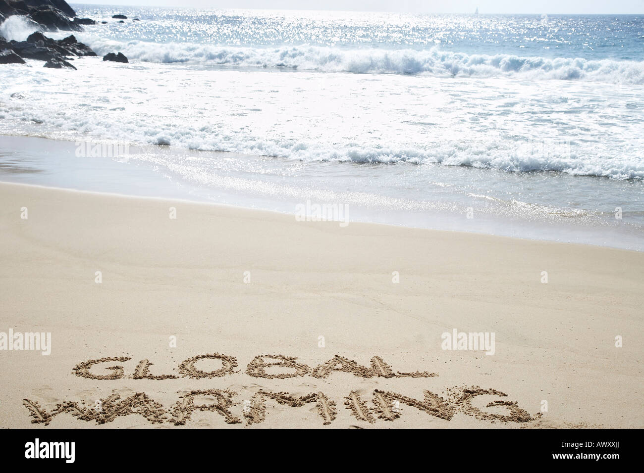 Global warming text written in beach, elevated view Stock Photo - Alamy