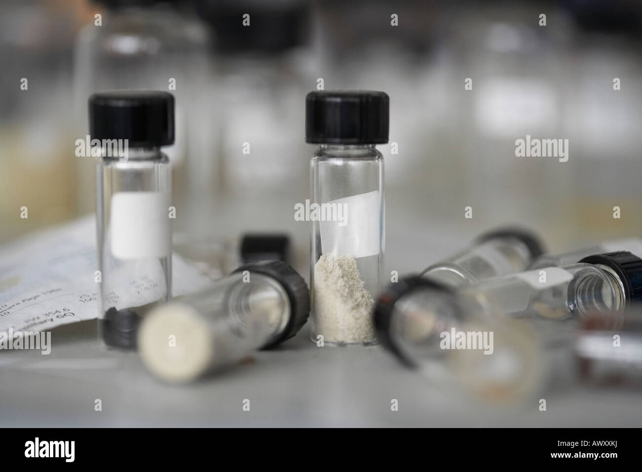 Sample bottles on table top, close up Stock Photo - Alamy