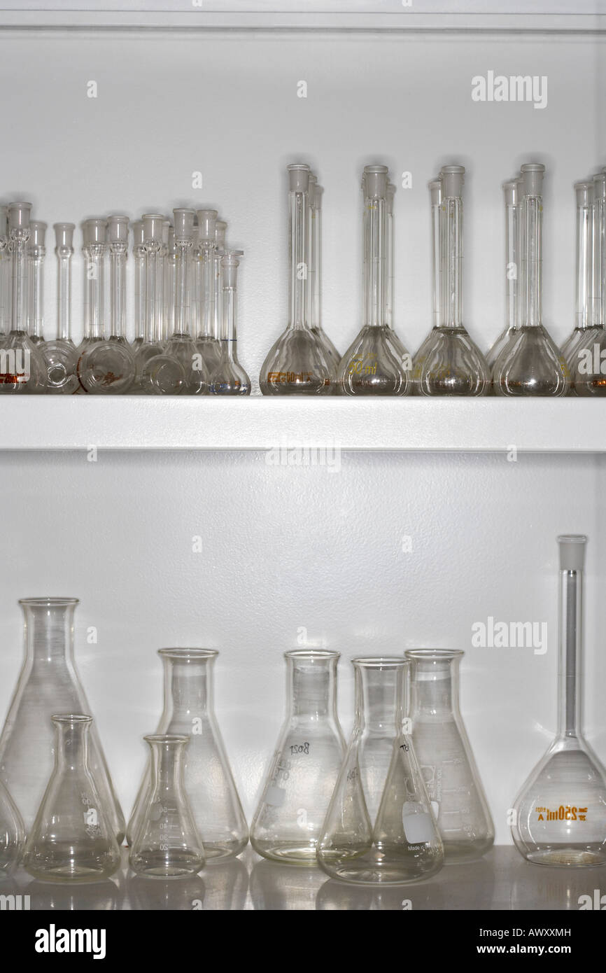 Laboratory flasks on shelves Stock Photo - Alamy