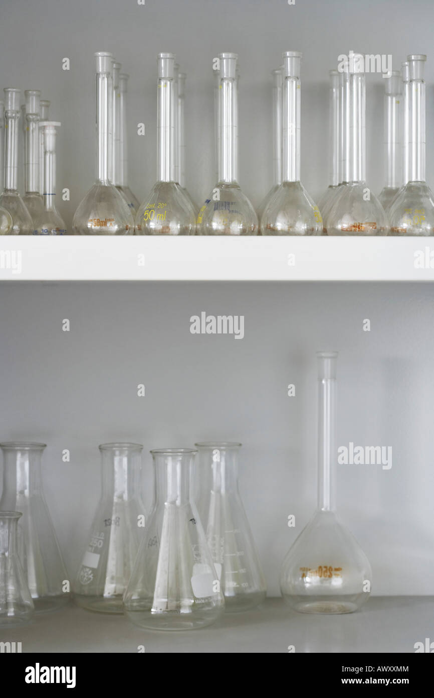 Laboratory flasks on shelves Stock Photo - Alamy
