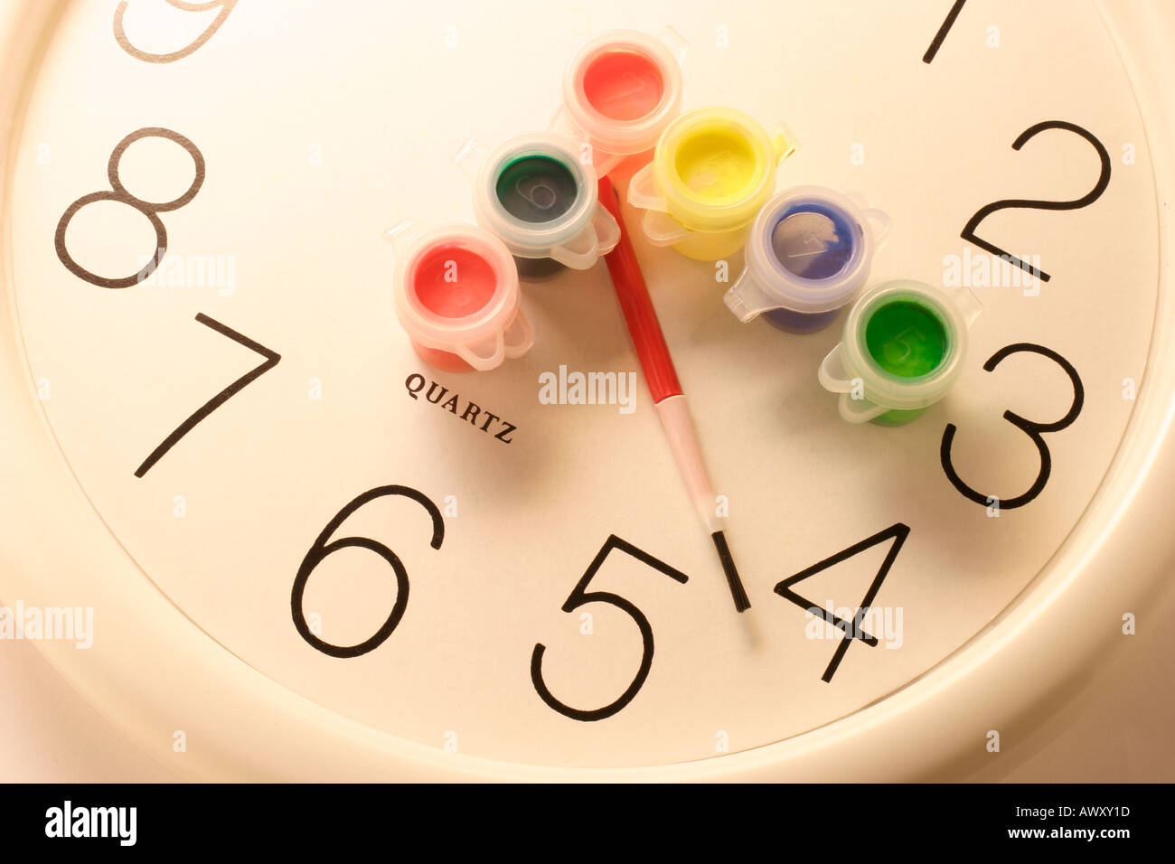 Brush and Paints on Clock Stock Photo - Alamy