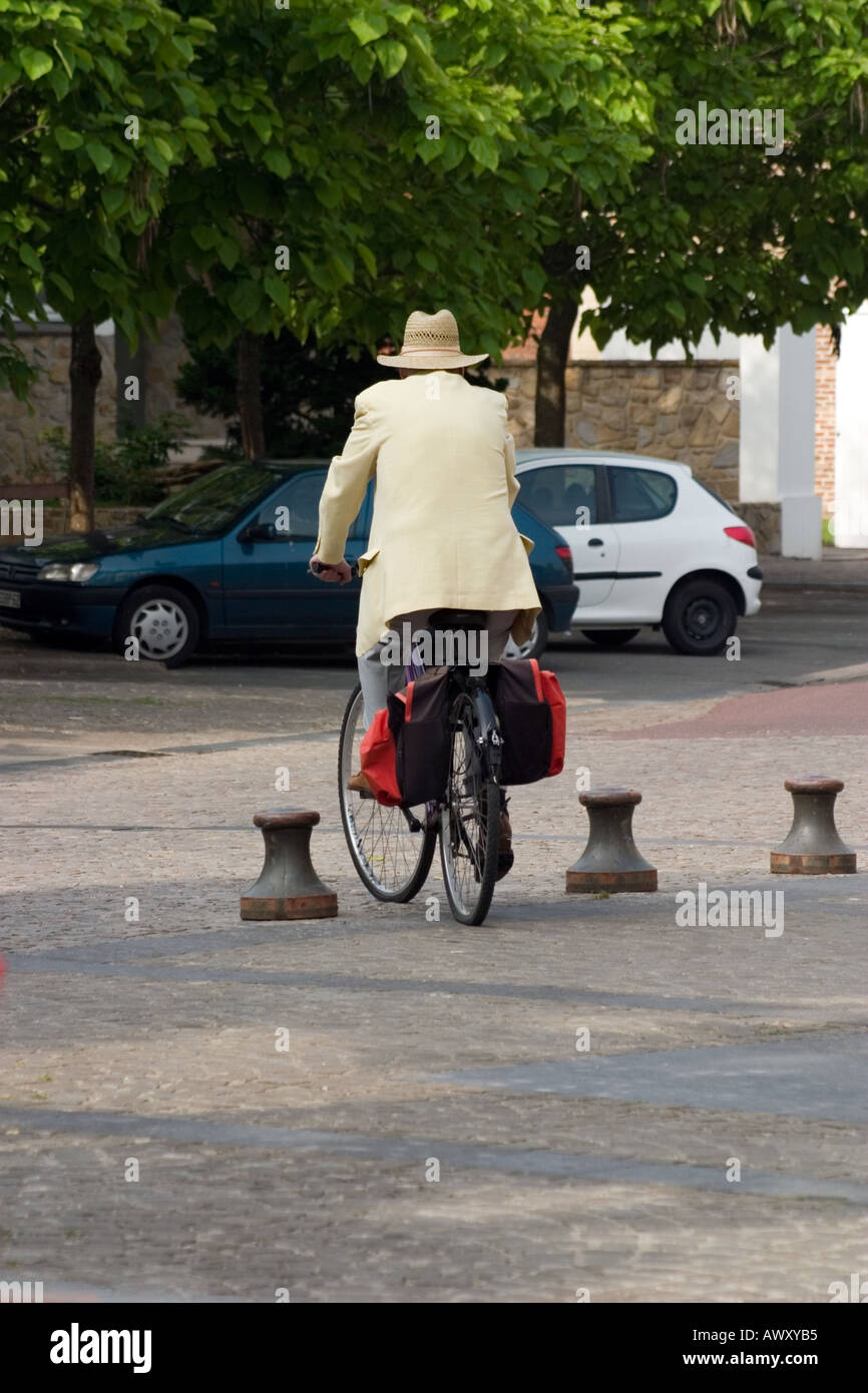 Elegant mature gentleman on bicycle wear pastel yellow blazer and straw ...