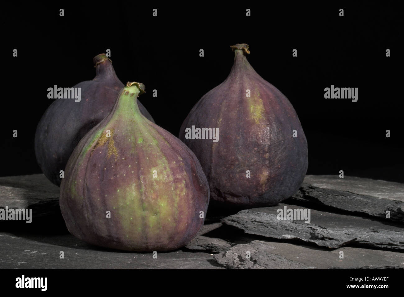 Still life of fresh figs on slate fragments Stock Photo - Alamy