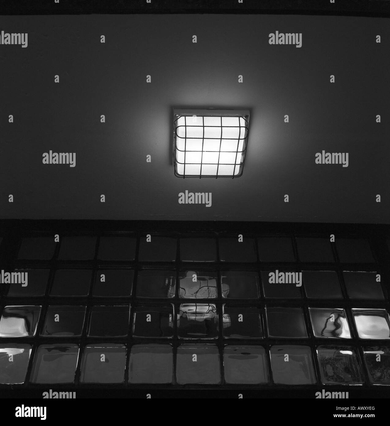 Light fixture over glass tile Stock Photo - Alamy