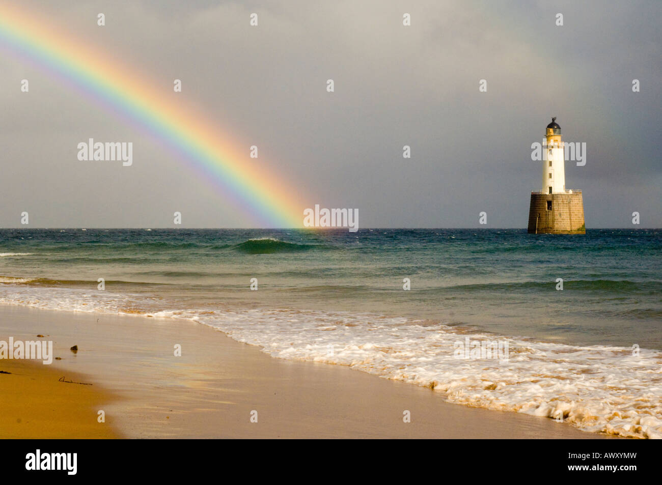 Rainbow over the sea at Rattray Head lighthouse in Aberdeenshire Stock ...