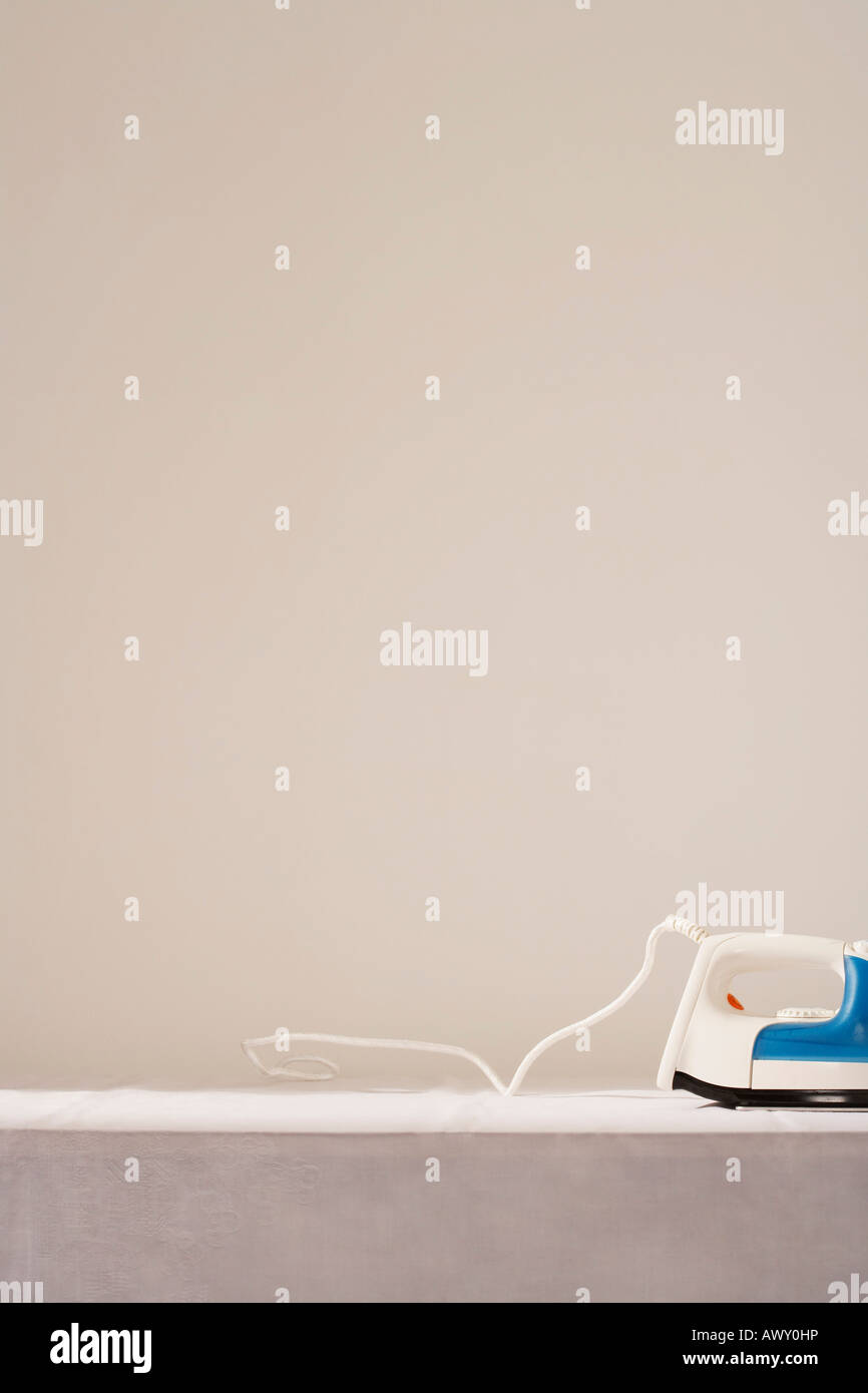 Iron on table Stock Photo - Alamy