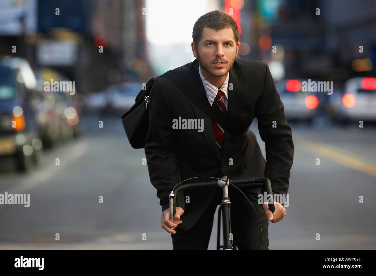 Man riding bicycle on street Stock Photo - Alamy