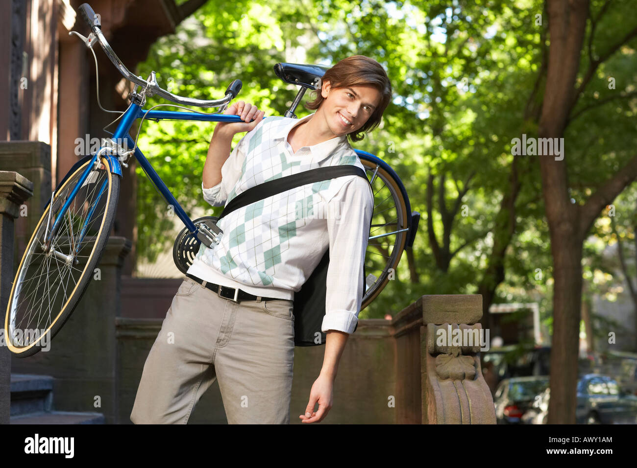 Man carrying bicycle, descending steps Stock Photo - Alamy