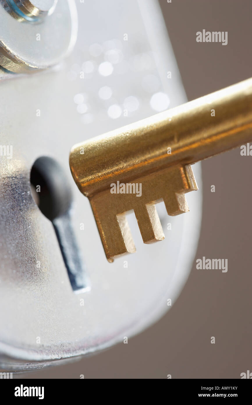 Golden key and padlock, close-up Stock Photo - Alamy