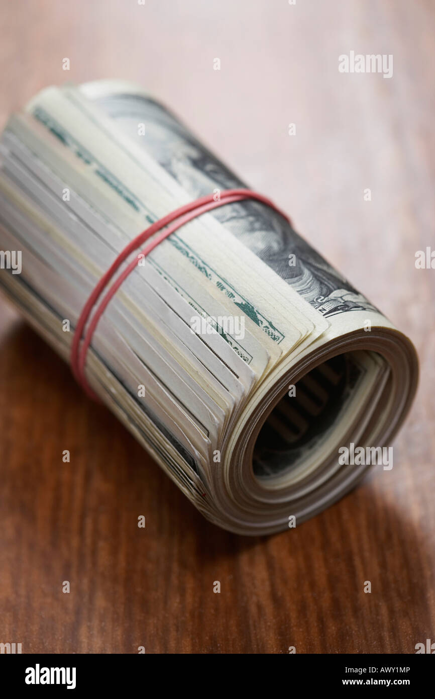 Roll of dollar bills, close-up Stock Photo - Alamy