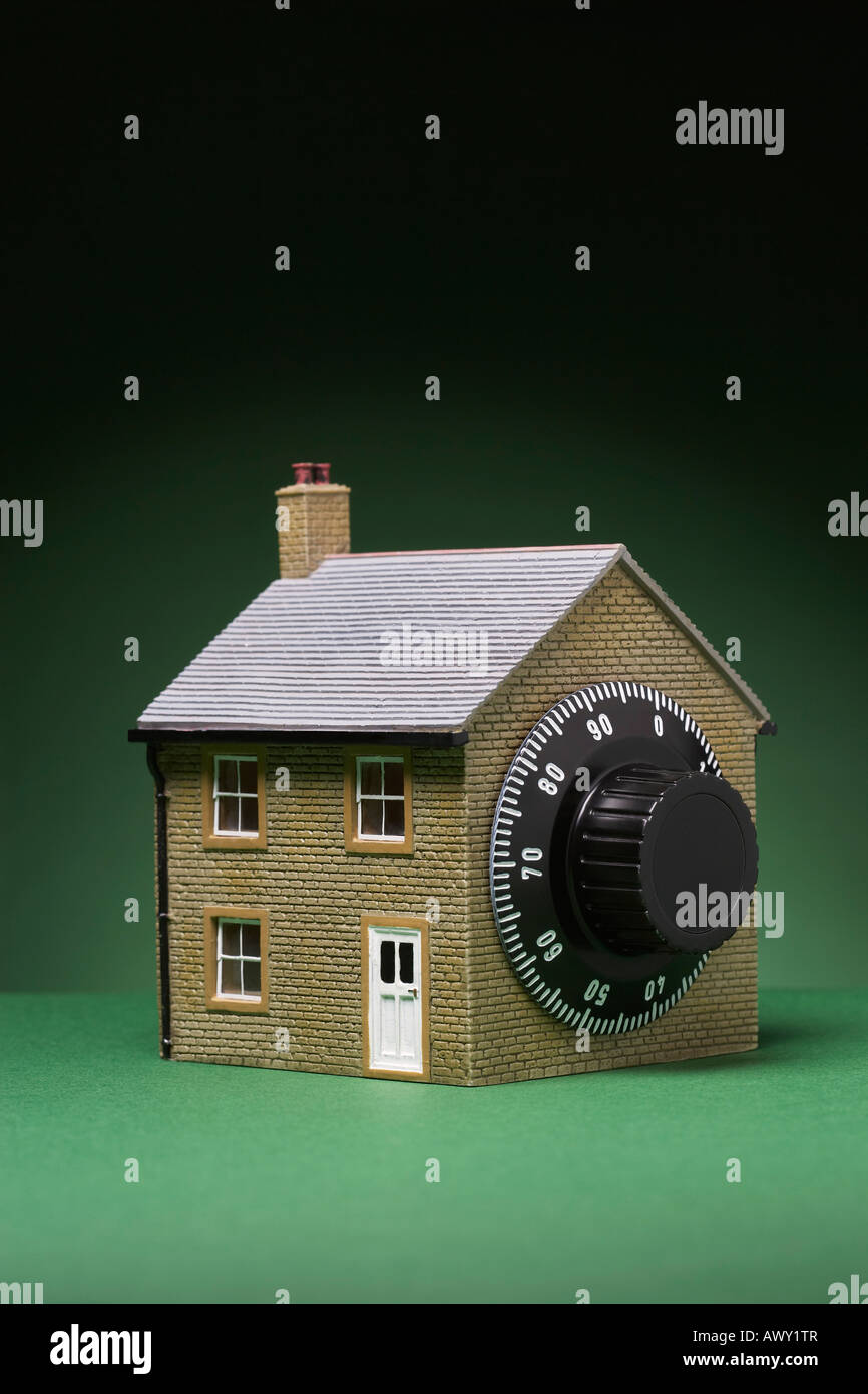 Small model of house with combination lock Stock Photo - Alamy