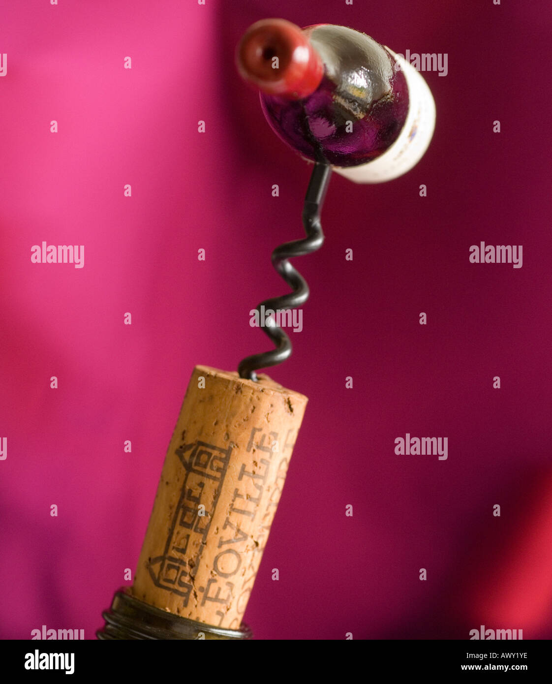 corkscrew shaped like a burgundy bottle opening a cork in a wine bottle ...