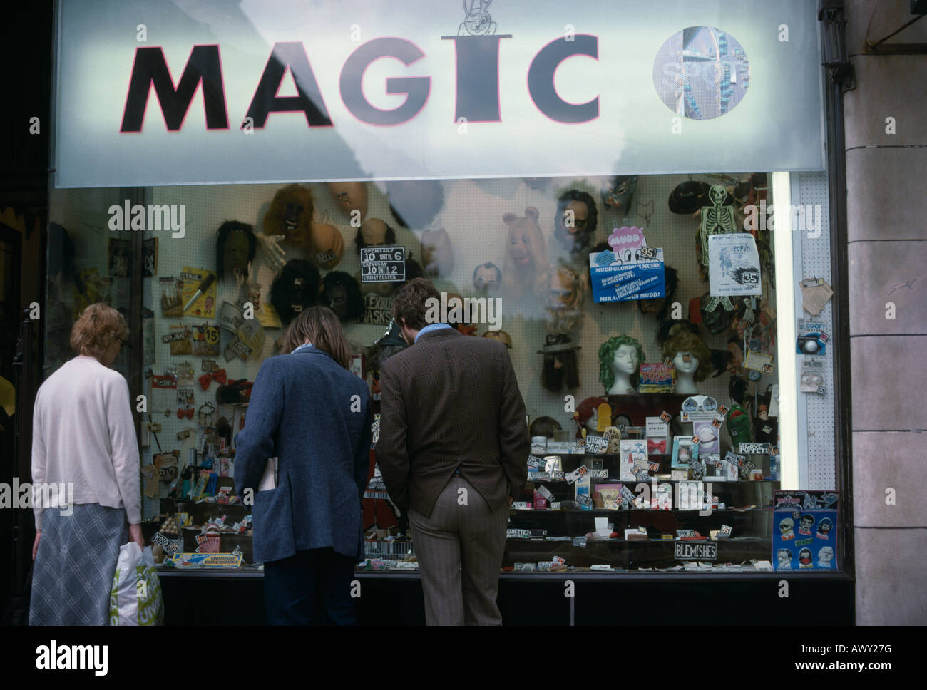 People looking into the window of Magic shop Stock Photo - Alamy