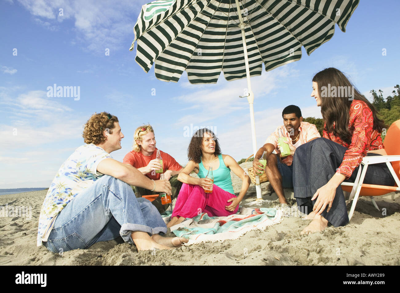 People relaxing at a beach party Stock Photo - Alamy