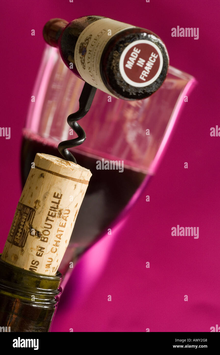 corkscrew shaped like a burgundy bottle opening a cork in a wine bottle ...