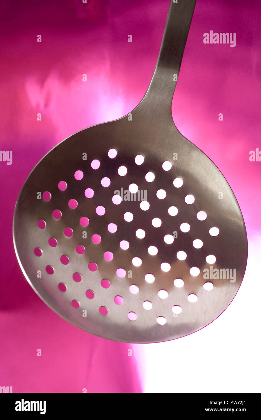 stainless steel sieve on a pink background Stock Photo - Alamy