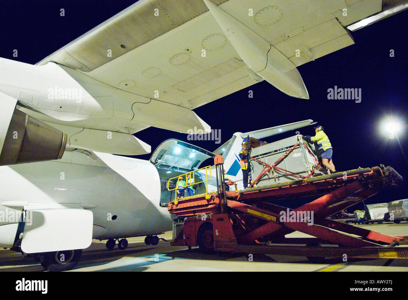 People loading aeroplane at airport Stock Photo - Alamy