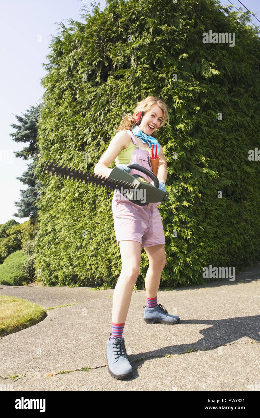 Woman trimming hedges hi-res stock photography and images - Alamy