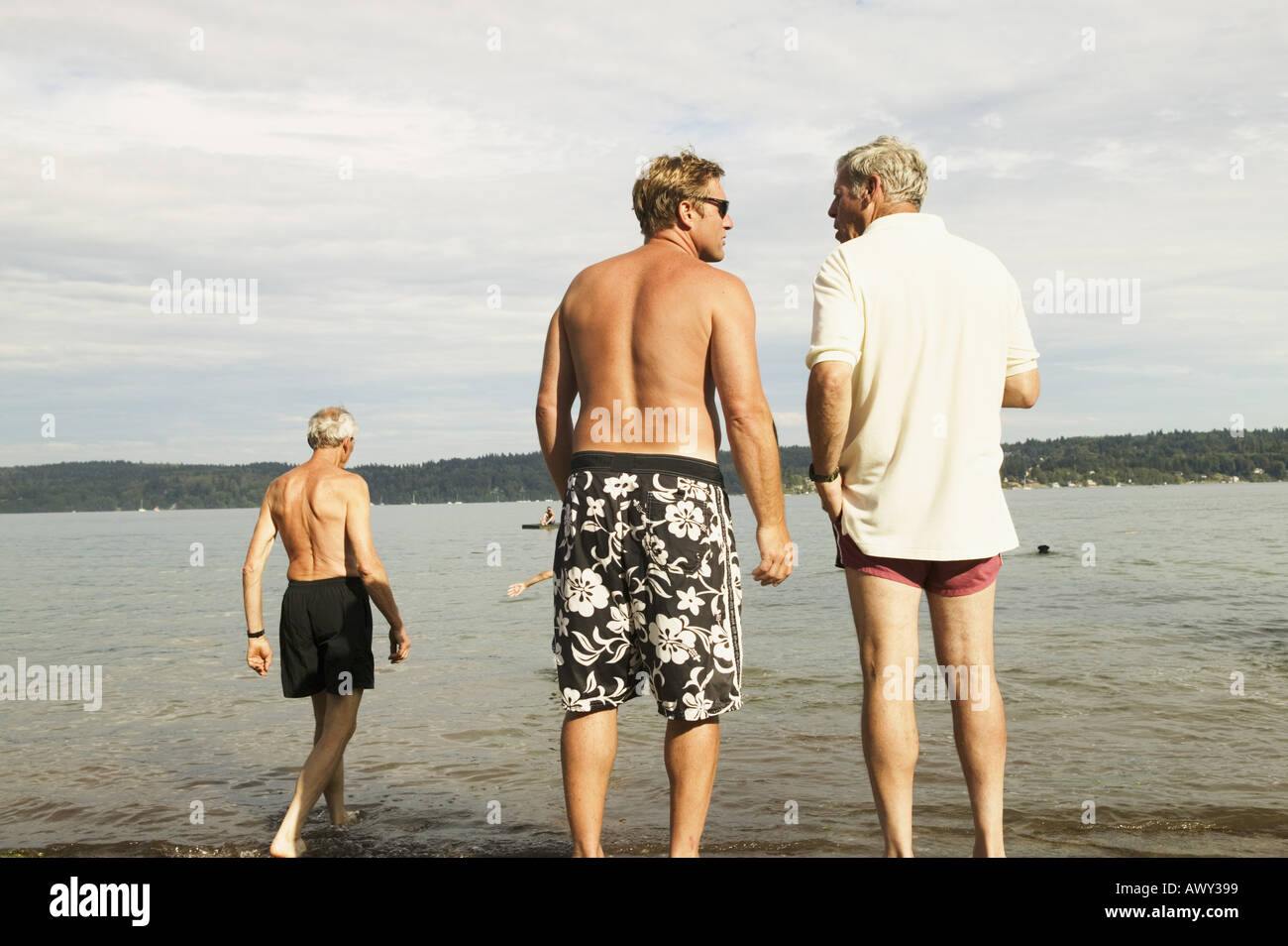 Men cooling off at the shore Stock Photo - Alamy