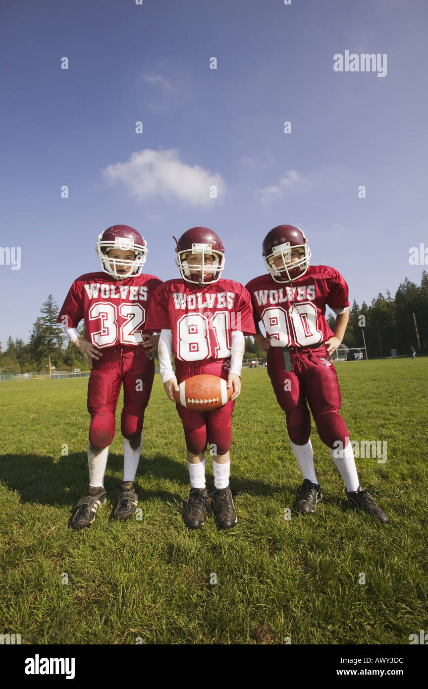 Group of three young football players Stock Photo - Alamy