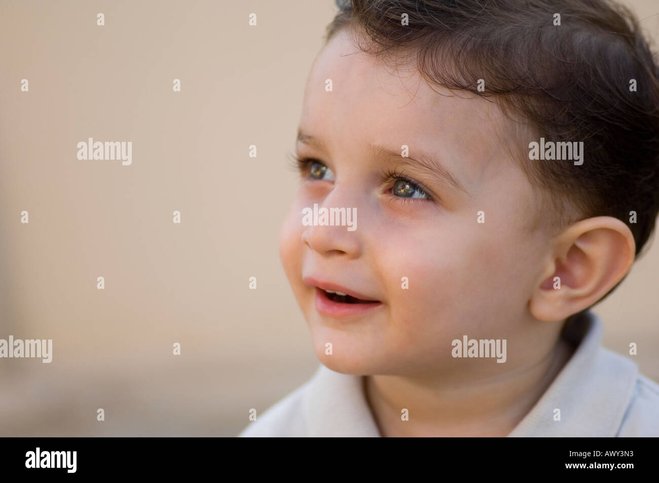 Happy young boy talking Stock Photo - Alamy