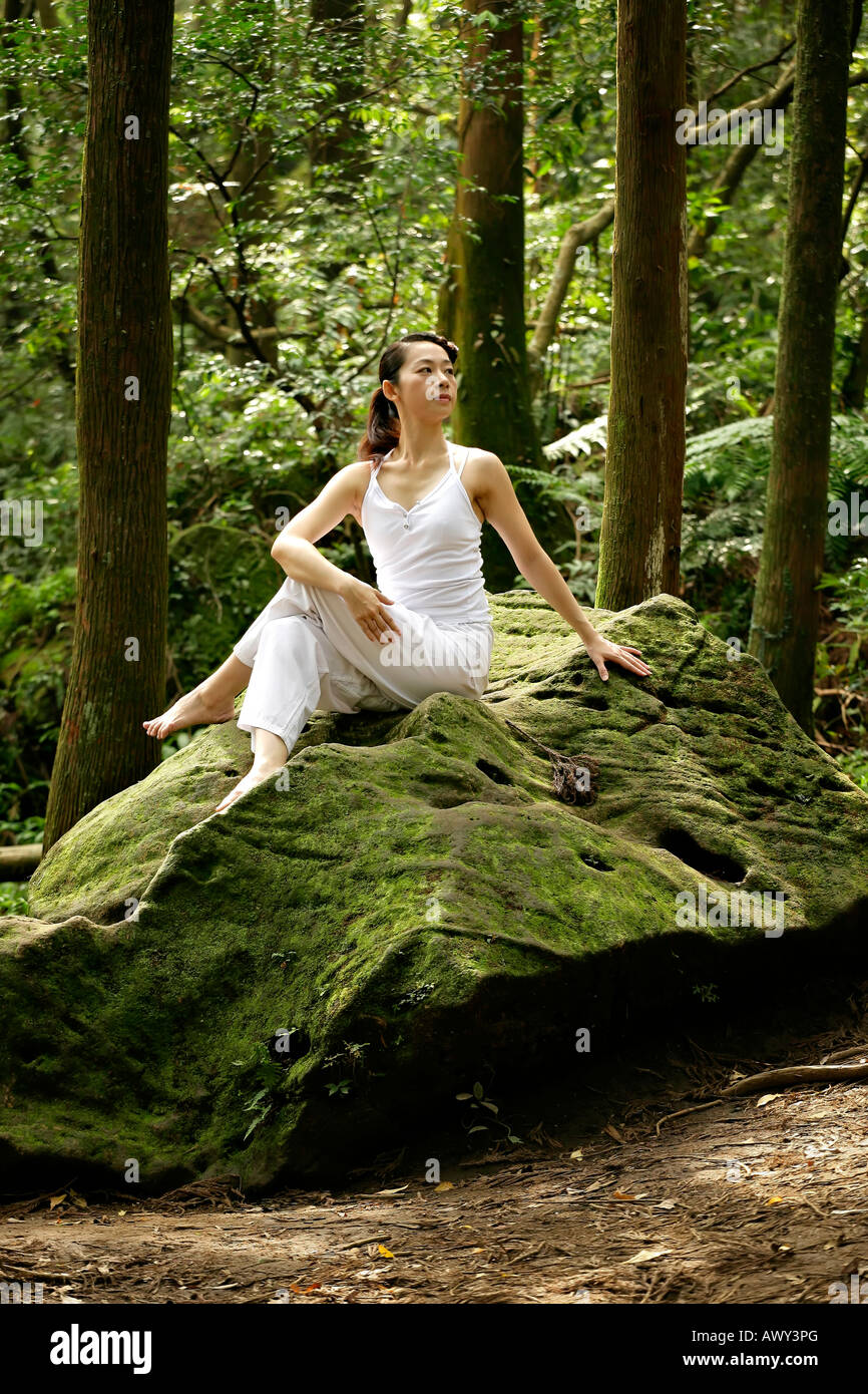 young woman practice yoga in forest Stock Photo - Alamy