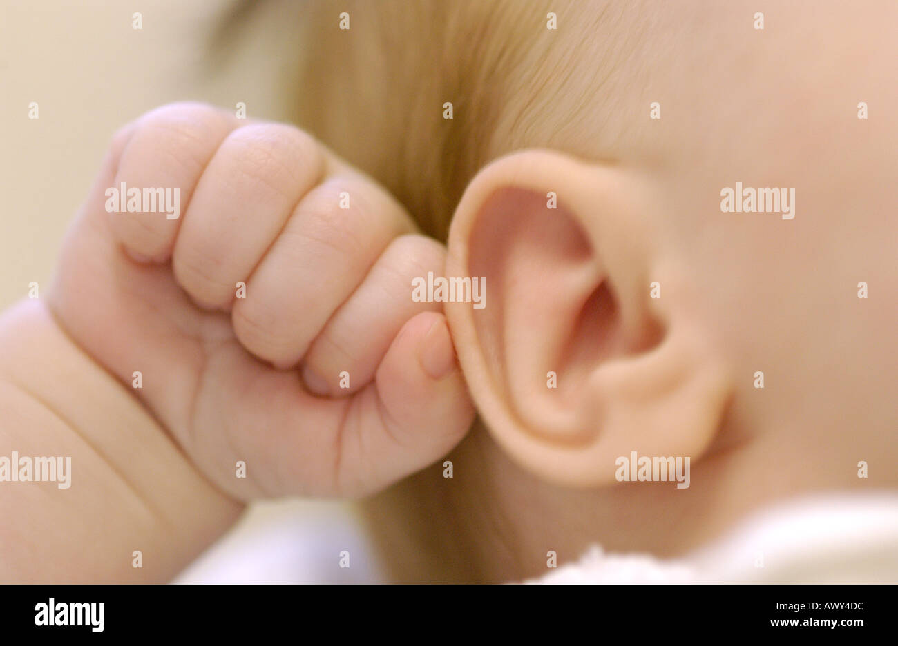 Hand to ear child hi-res stock photography and images - Alamy