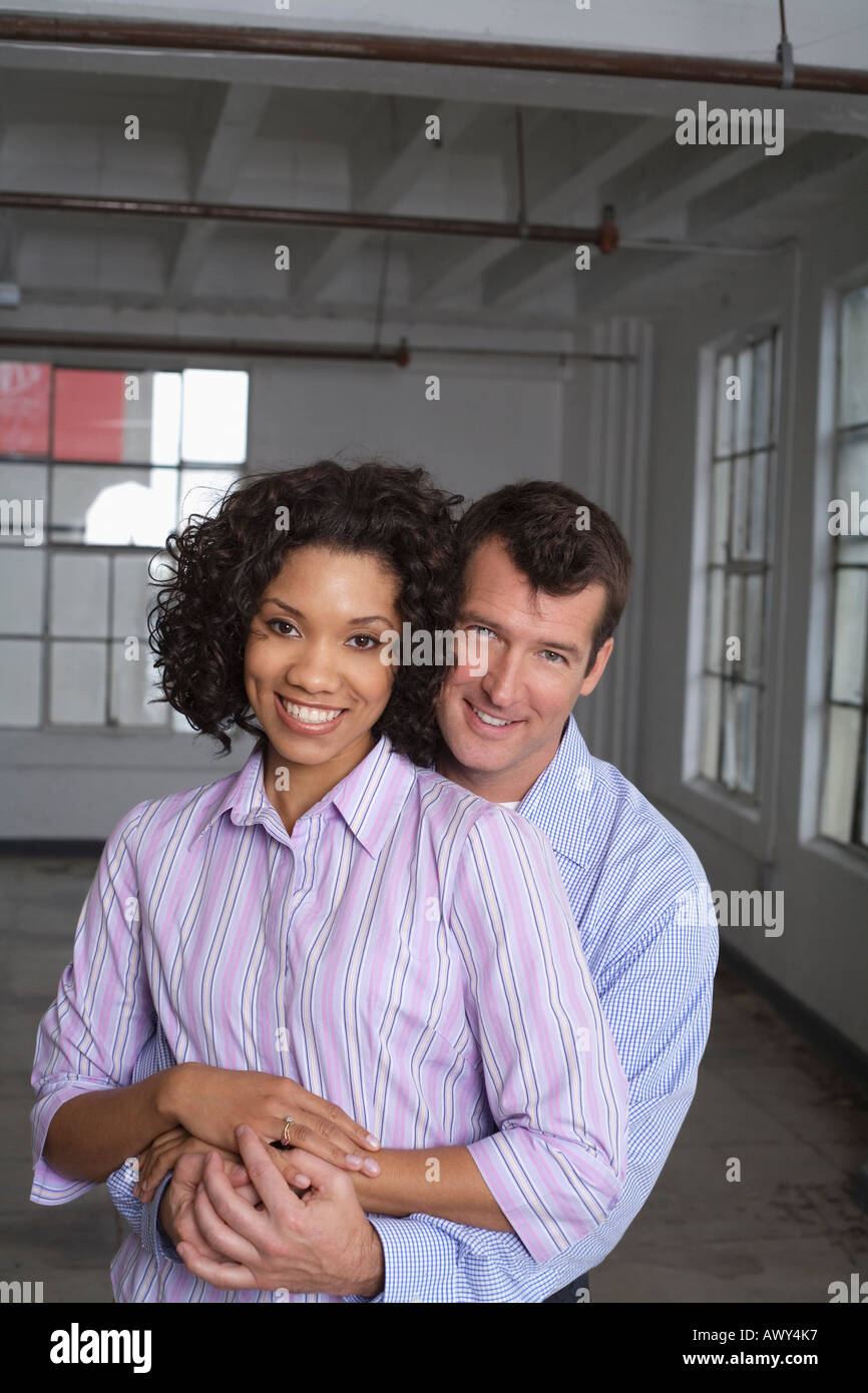 Portrait of Couple in Empty Loft Apartment Stock Photo - Alamy