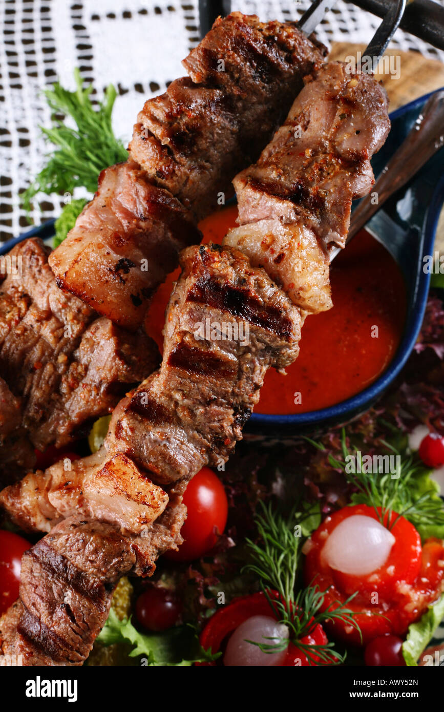 Fried kebab meat with red pepper Stock Photo - Alamy