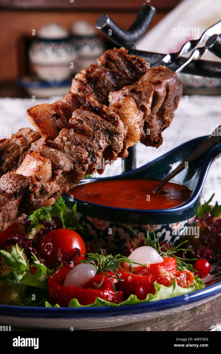 Fried kebab meat with red pepper Stock Photo - Alamy