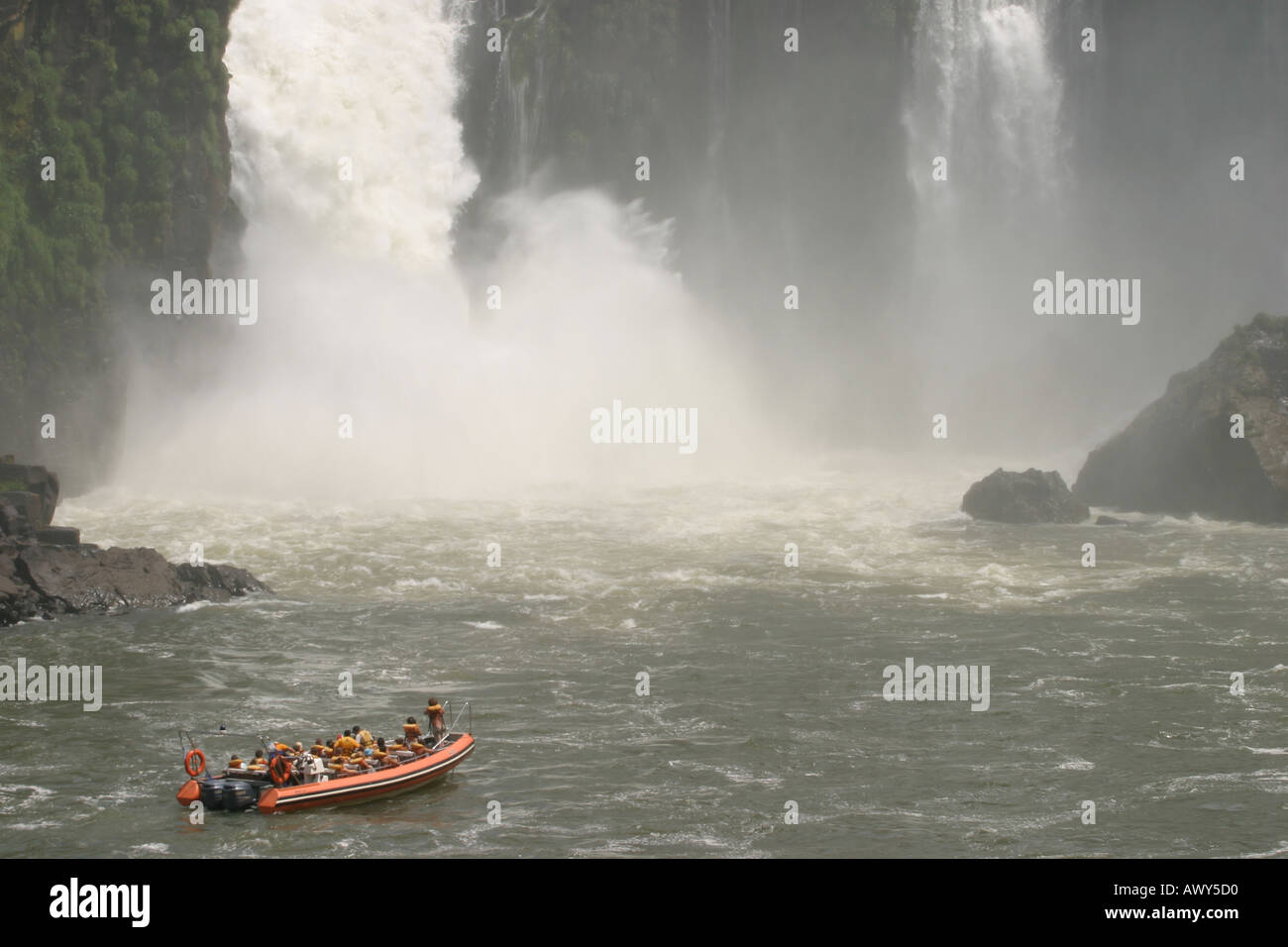 Tourist boat ride under the falls iguazu falls argentina hi-res stock ... Tourist boat ride under the falls iguazu falls argentina hi-res stock ...