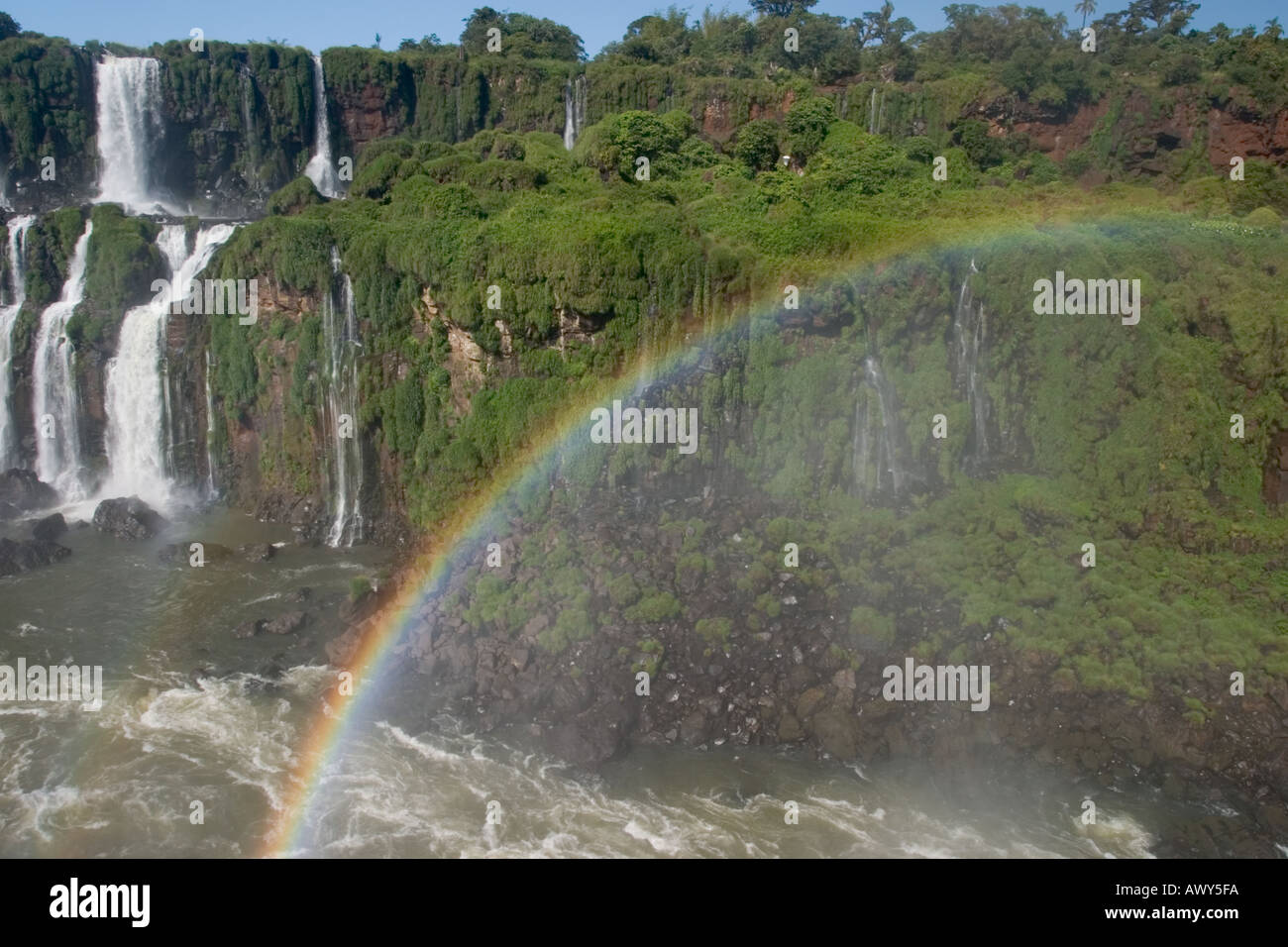 Rainbow real over Iguazu Falls from the Brazilian side Stock Photo - Alamy